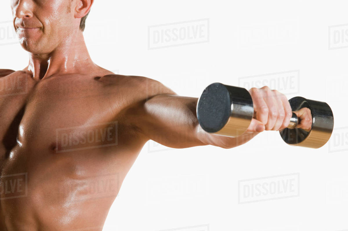 Male body builder flexing lifting weight - Stock Photo - Dissolve