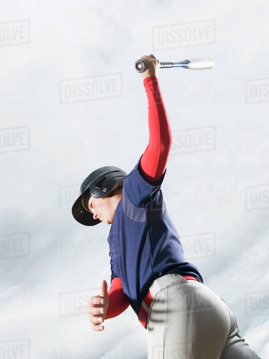 Baseball player swinging bat - Royalty-free Stock Photo | Dissolve