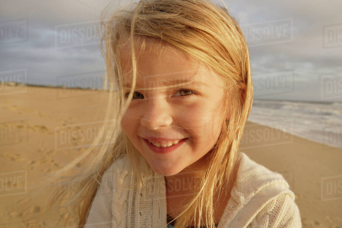 Girl laughing at beach - Stock Photo - Dissolve