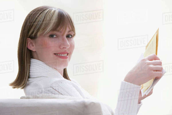 Woman holding mail - Royalty-free Stock Photo | Dissolve