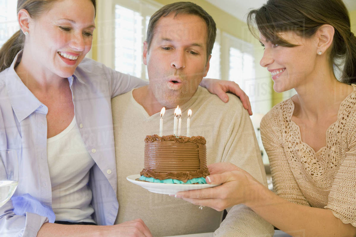 Man celebrating birthday - Royalty-free Stock Photo | Dissolve