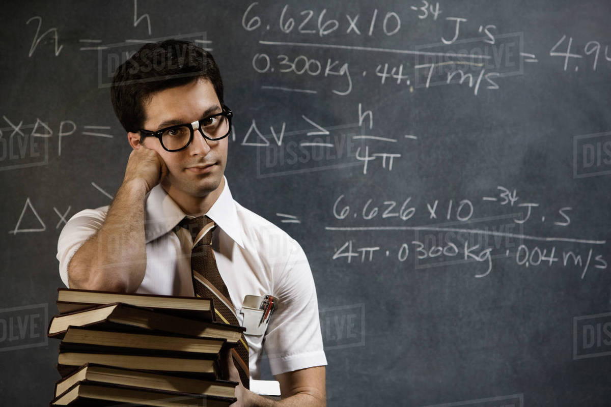 Nerdy man in front of blackboard - Royalty-free Stock Photo | Dissolve