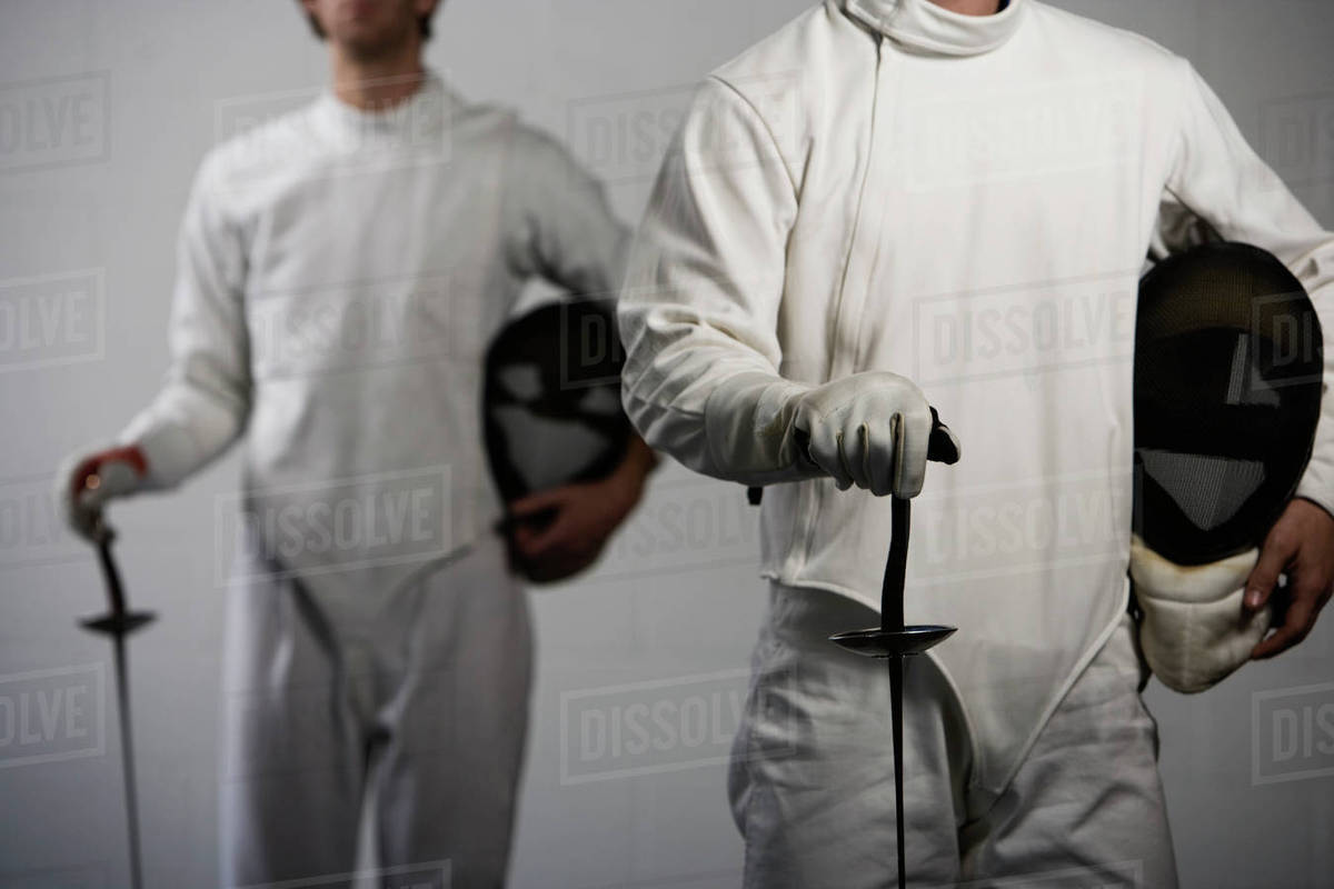 Portrait of fencers holding masks and fencing foils - Royalty-free ...