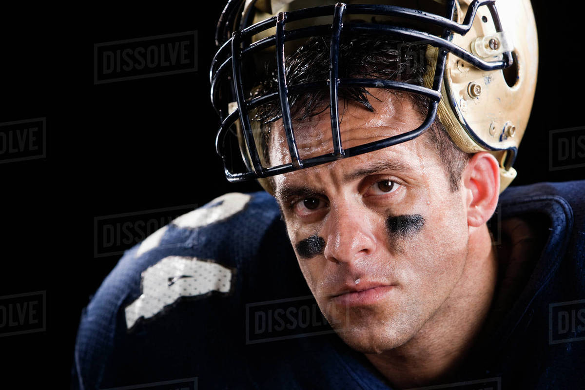 Football player looking serious - Royalty-free Stock Photo | Dissolve