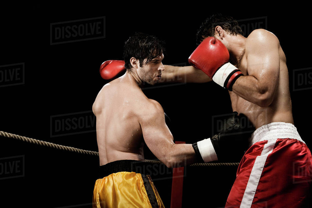 Boxers fighting in boxing ring - Royalty-free Stock Photo | Dissolve