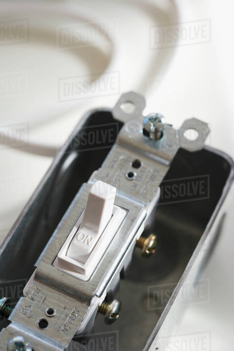 Close up of light switch - Stock Photo - Dissolve