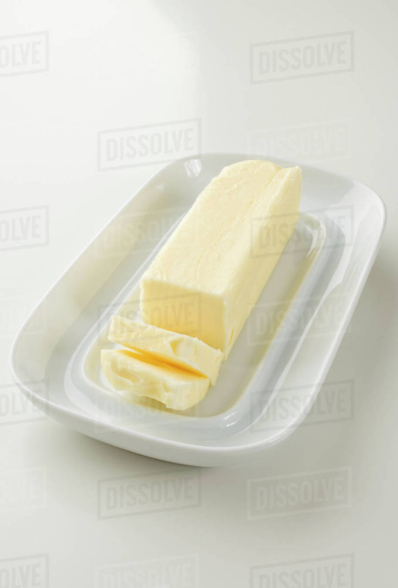 Close up of butter in dish - Stock Photo - Dissolve