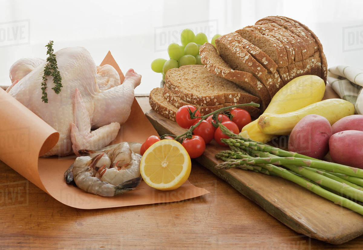 Assorted food groups on table - Royalty-free Stock Photo | Dissolve