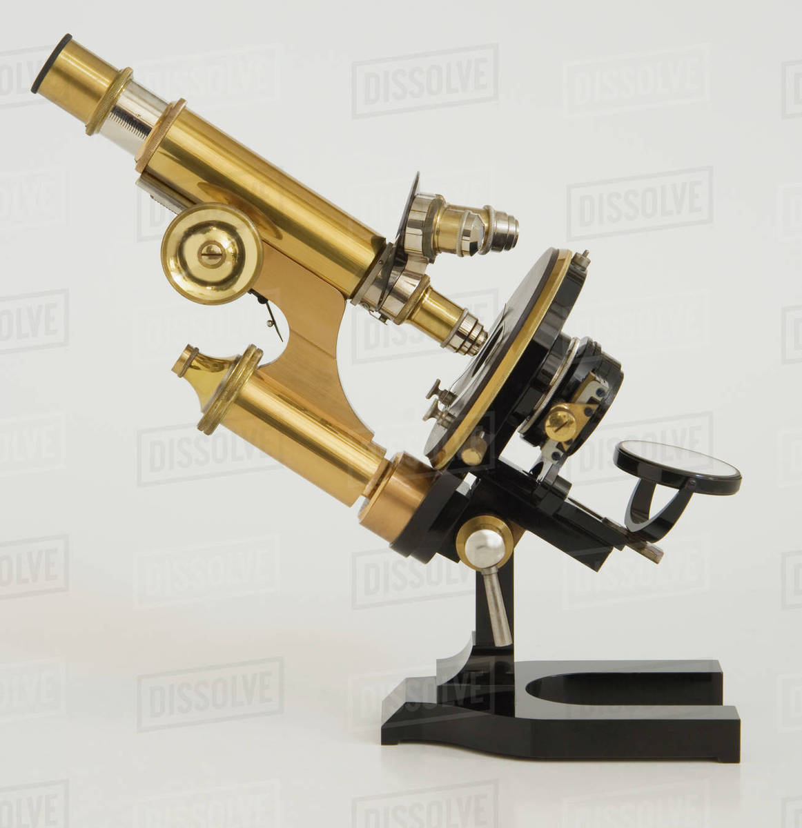 Close up of old fashioned microscope - Stock Photo - Dissolve