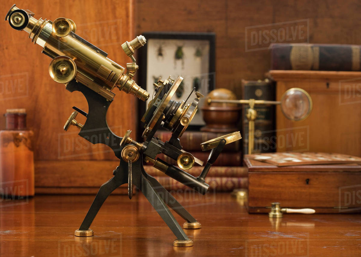 Old fashioned microscope on table - Royalty-free Stock Photo | Dissolve