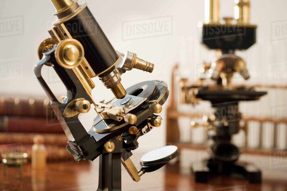 Old fashioned microscopes on table - Royalty-free Stock Photo | Dissolve