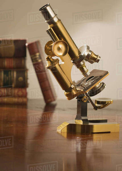 Old fashioned microscope on table - Royalty-free Stock Photo | Dissolve