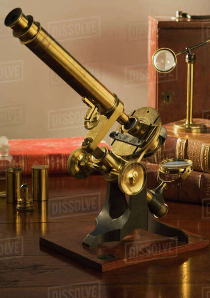 Old fashioned microscope on table - Royalty-free Stock Photo | Dissolve