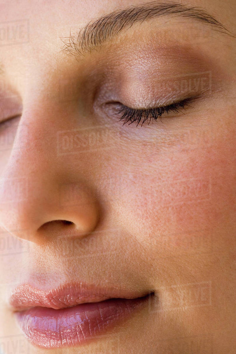 Woman’s face with eyes closed - Stock Photo - Dissolve