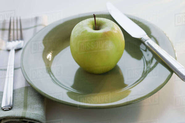 Apple on plate - Stock Photo - Dissolve