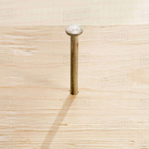 Close up of nail in wood - Royalty-free Stock Photo | Dissolve