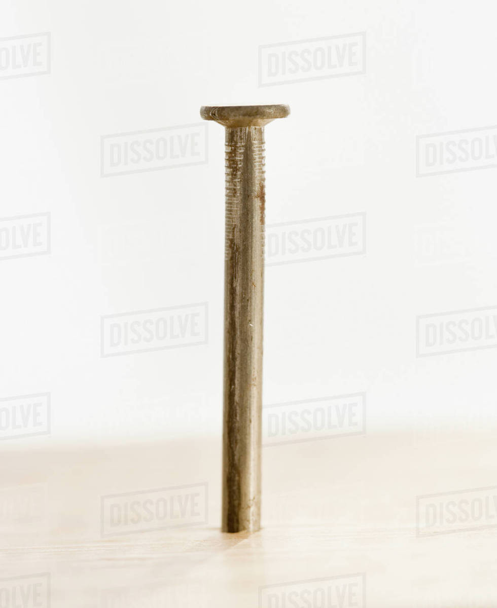 Close up of nail in wood - Royalty-free Stock Photo | Dissolve