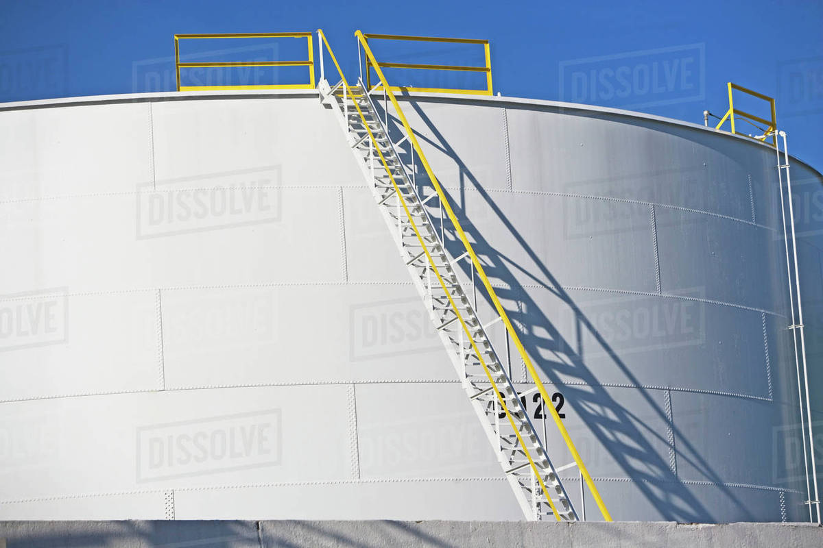 Ladder on cylindrical container - Royalty-free Stock Photo | Dissolve