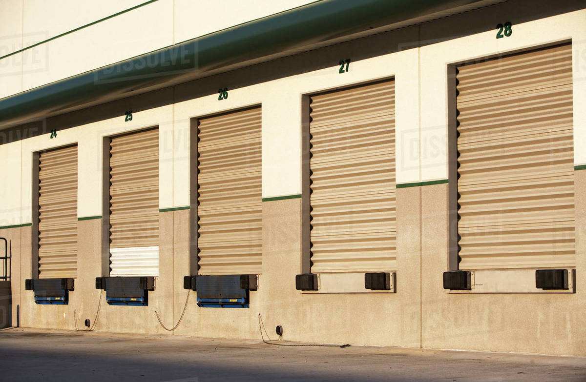 Row of closed loading docks - Royalty-free Stock Photo | Dissolve