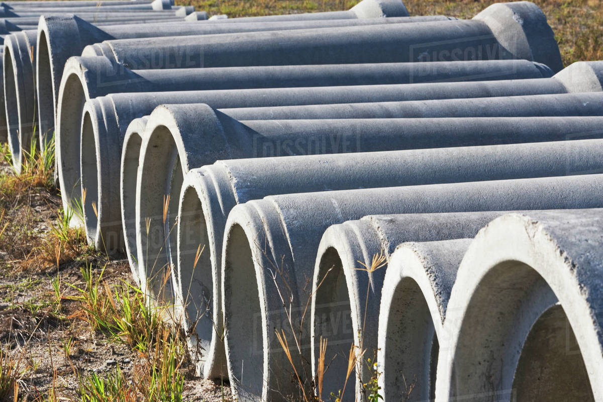 Concrete pipes on ground - Stock Photo - Dissolve
