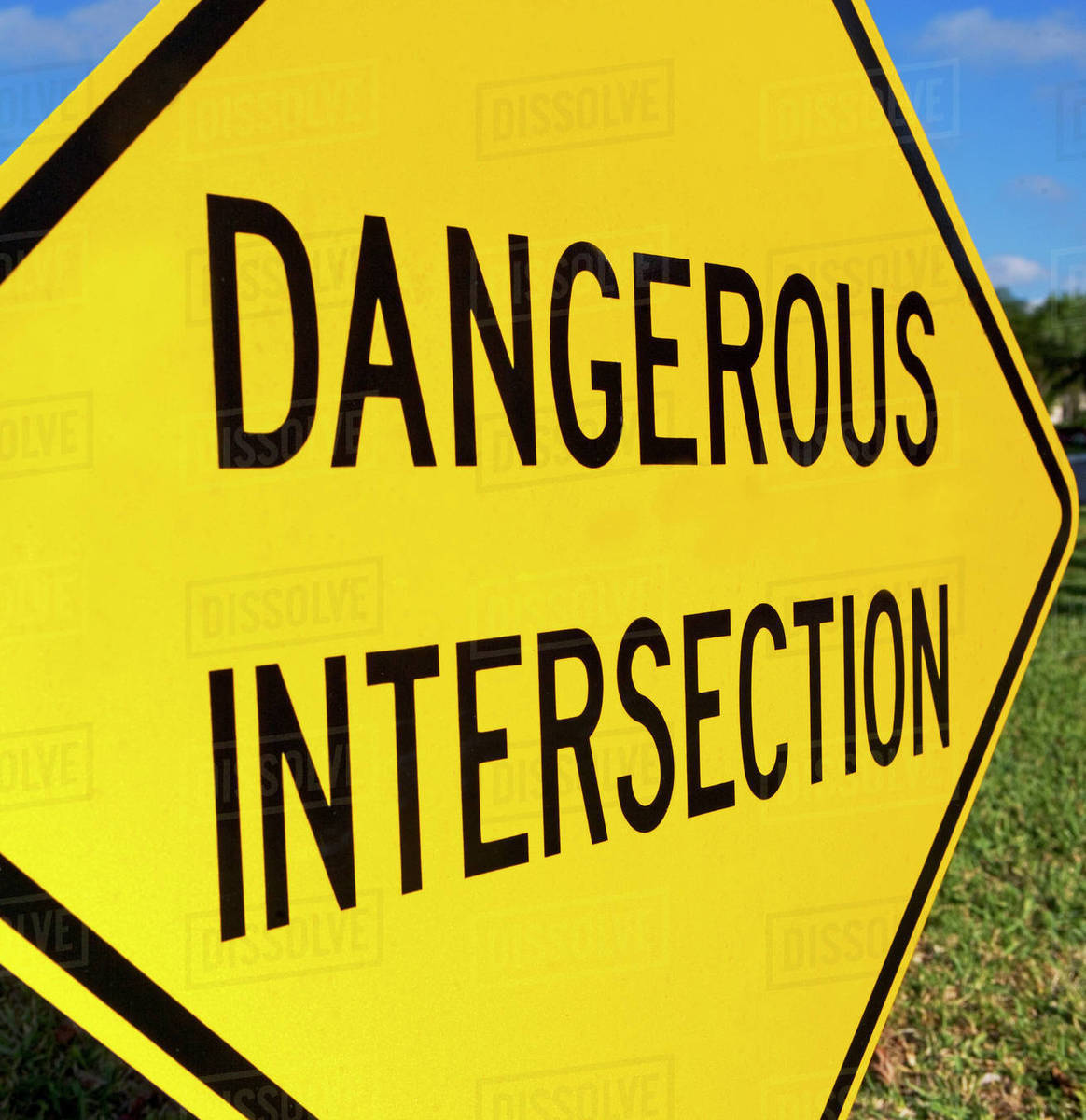 Close up of Dangerous Intersection sign - Royalty-free Stock Photo ...