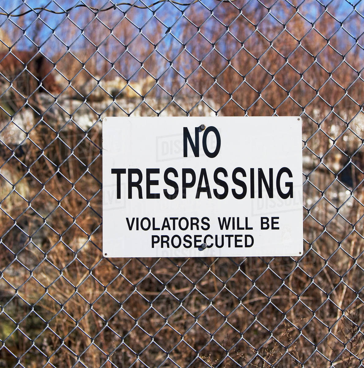 No Trespassing sign on fence - Royalty-free Stock Photo | Dissolve