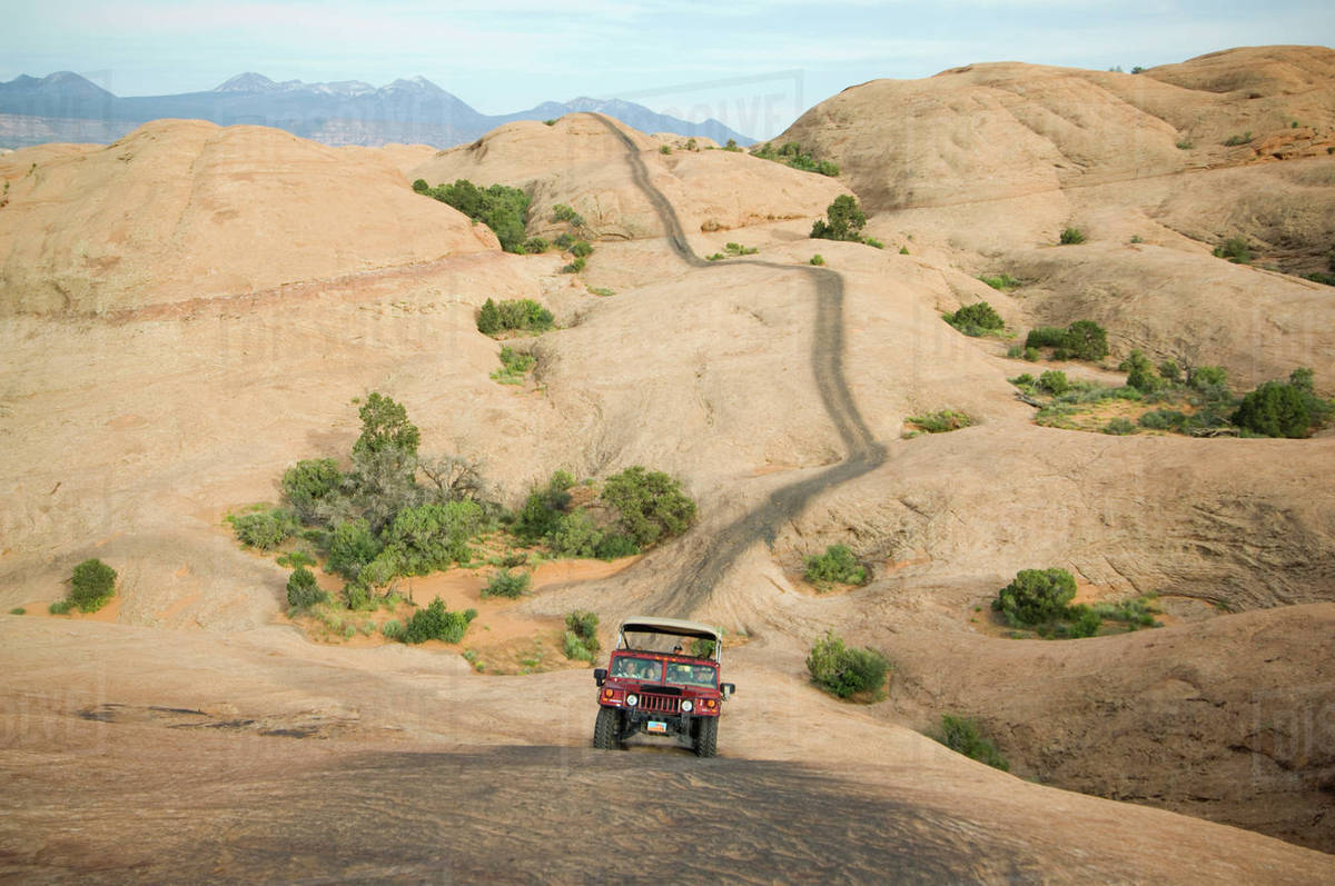 Off-road vehicle driving on rock formation - Royalty-free Stock Photo ...