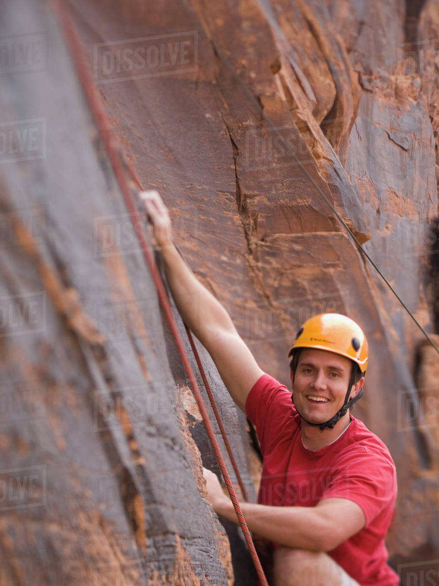 Close up of man rock climbing - Royalty-free Stock Photo | Dissolve