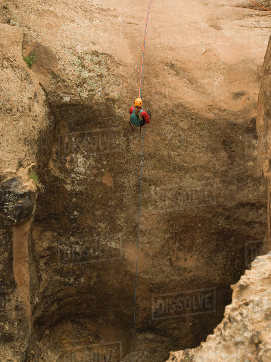 Man canyon rappelling - Royalty-free Stock Photo | Dissolve