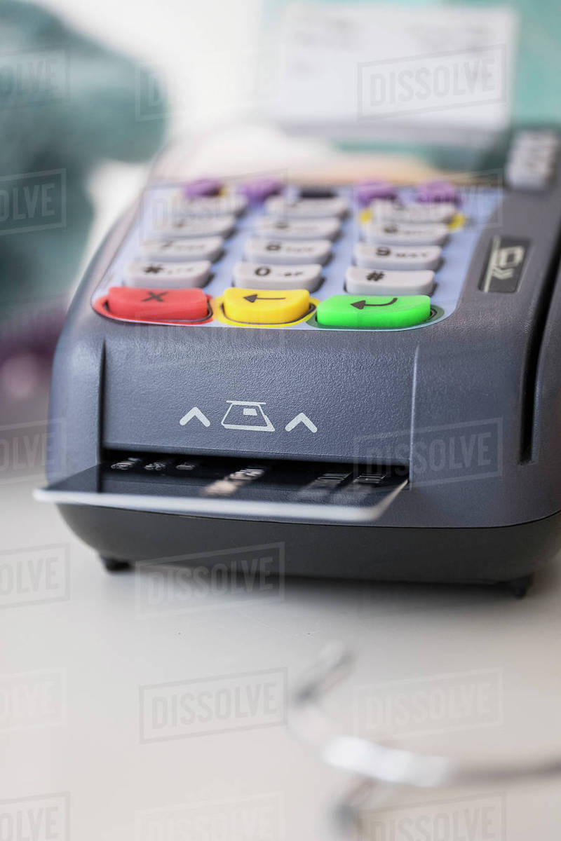 Credit card reader on counter - Royalty-free Stock Photo | Dissolve