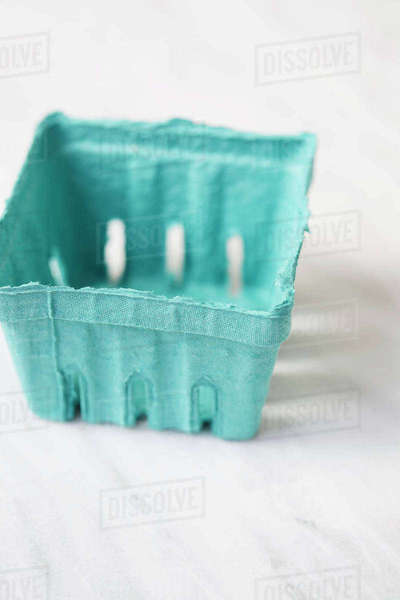 Empty blue fruit carton on marble table - Royalty-free Stock Photo ...