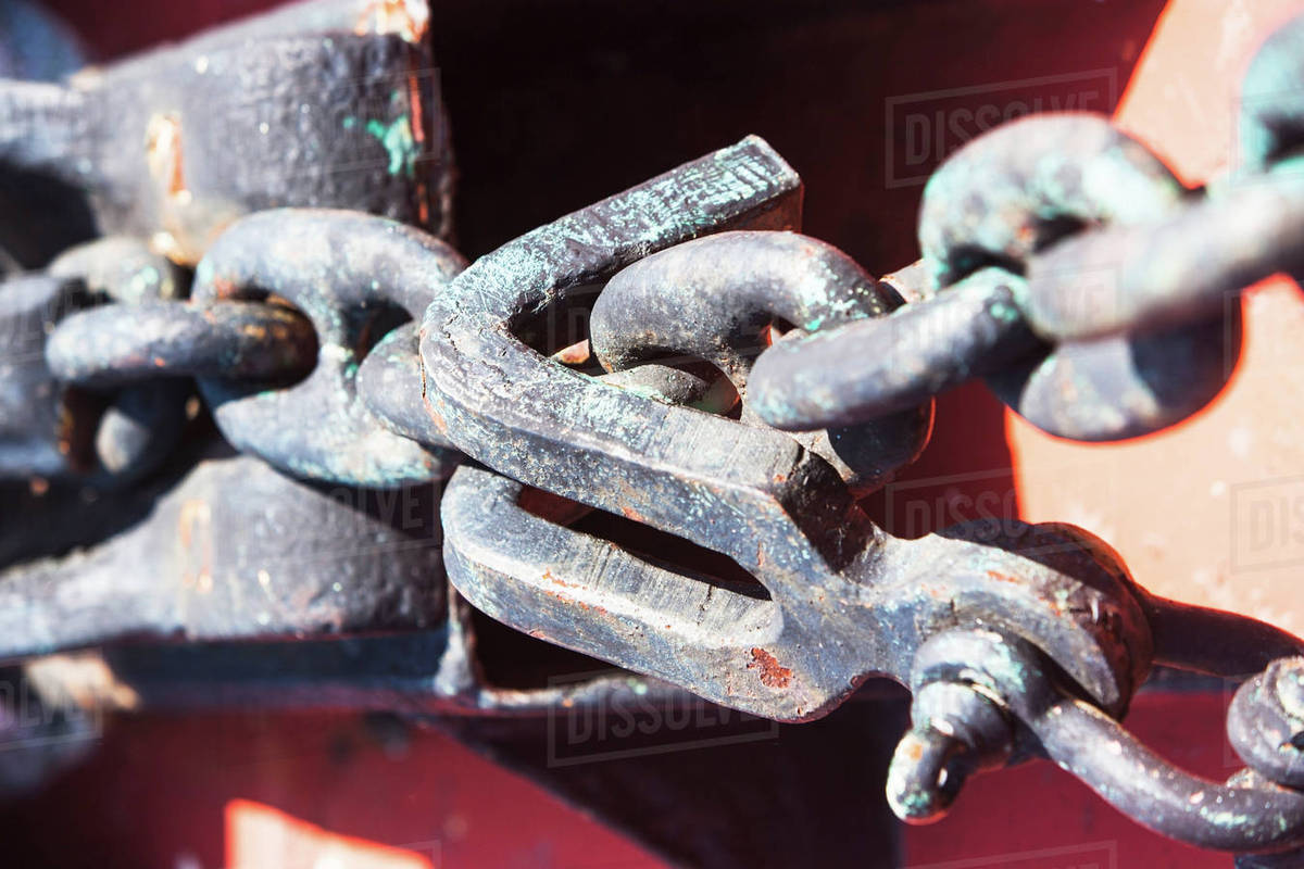Close-up view of chain and hook - Royalty-free Stock Photo | Dissolve