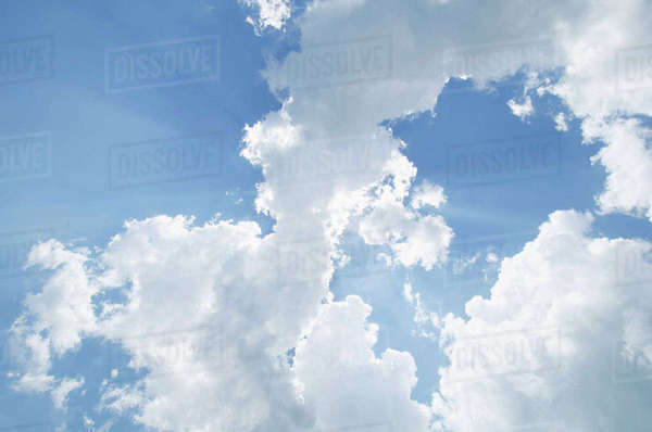 Sun rays shining through clouds - Royalty-free Stock Photo | Dissolve