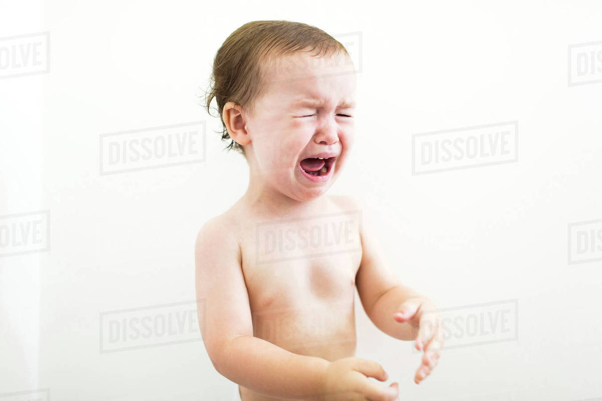 Shirtless boy (4-5) crying - Royalty-free Stock Photo | Dissolve