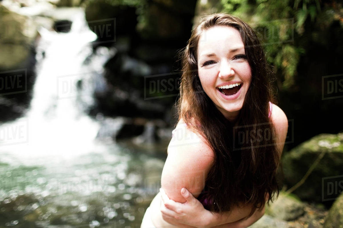Caribbean Islands, Saint Lucia, Women by waterfall bending and hugging ...
