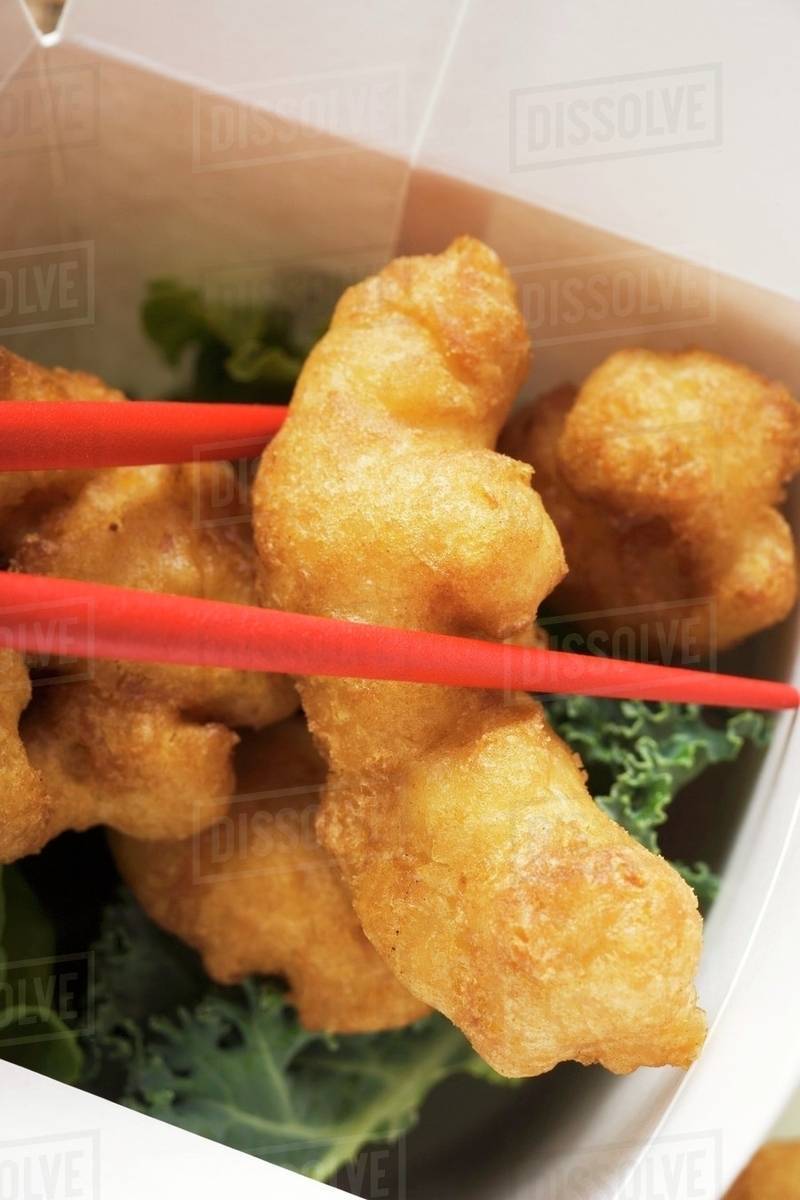Asian chicken nuggets to take away - Stock Photo - Dissolve