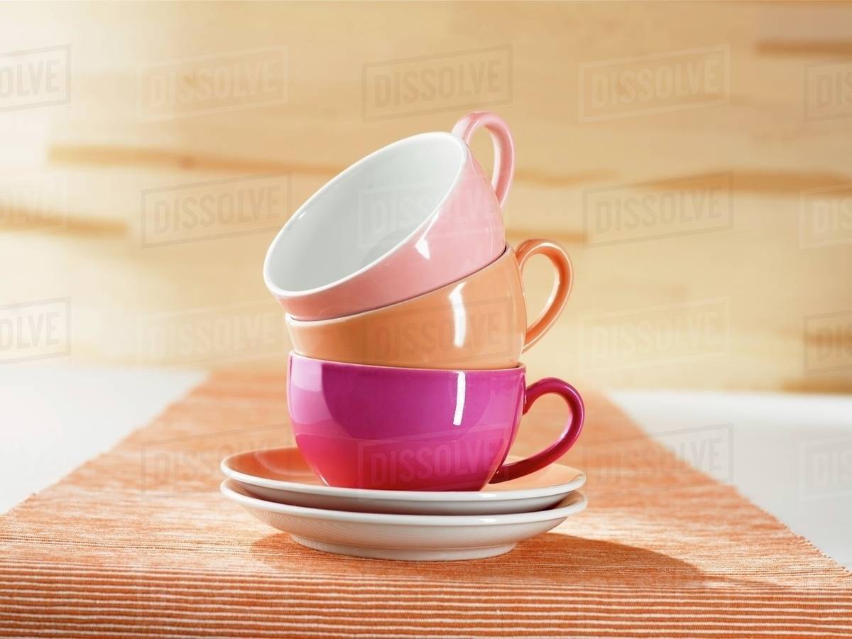 A stack of colourful cups - Royalty-free Stock Photo | Dissolve