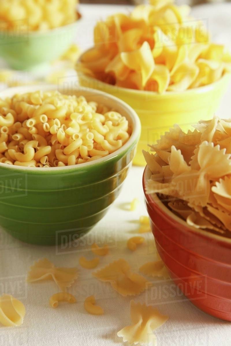Various Pastas in Colored Bowls - Royalty-free Stock Photo | Dissolve
