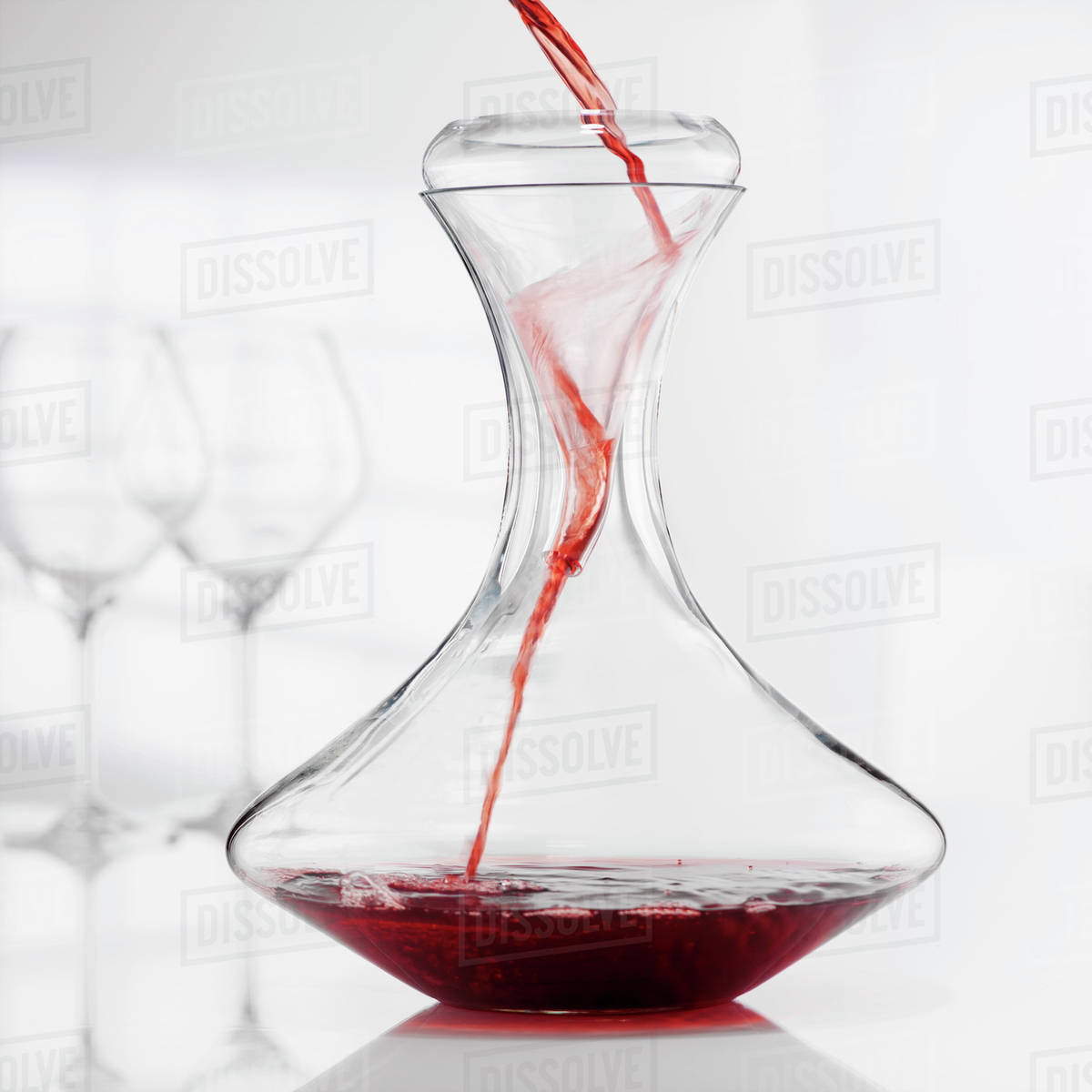 Red wine being decanted - Royalty-free Stock Photo | Dissolve