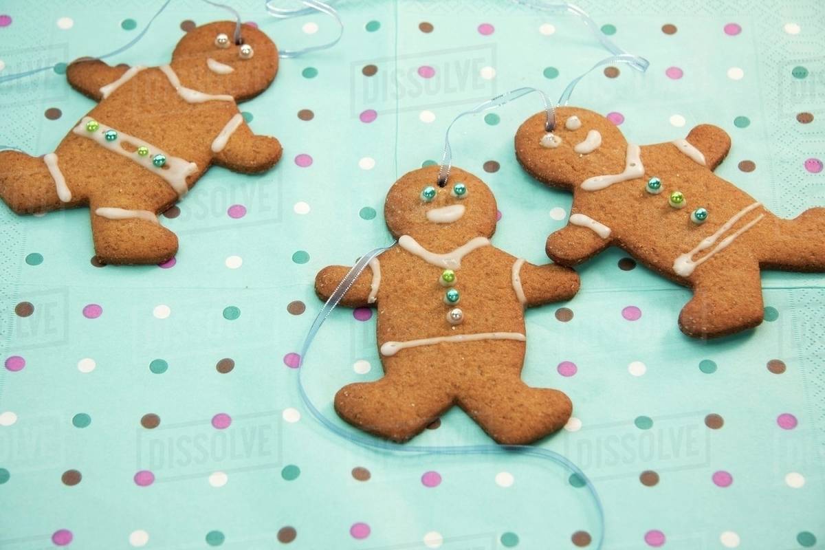 Gingerbread men on spotted background - Stock Photo - Dissolve