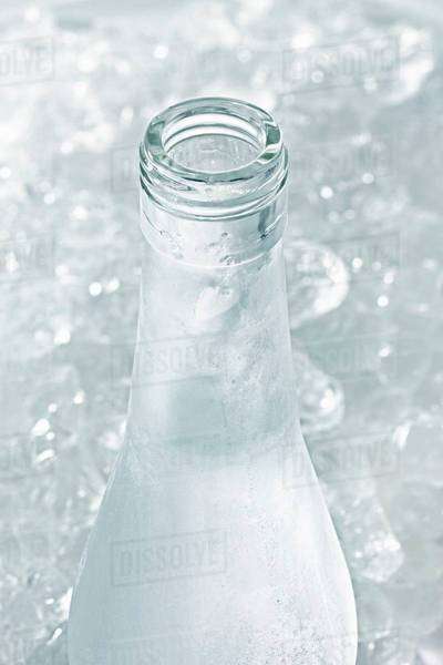 Ouzo in icy bottle - Stock Photo - Dissolve