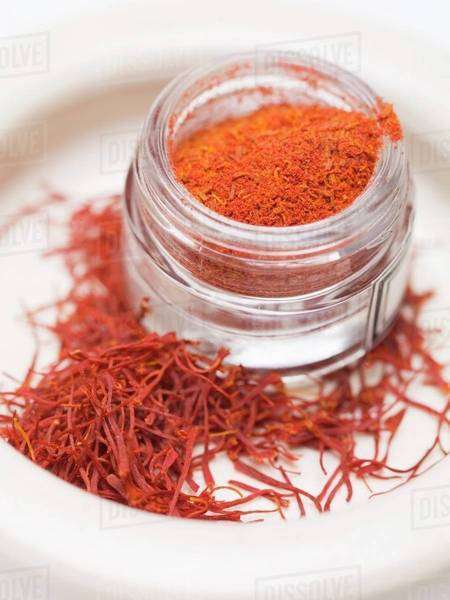 Saffron powder and saffron threads - Royalty-free Stock Photo | Dissolve