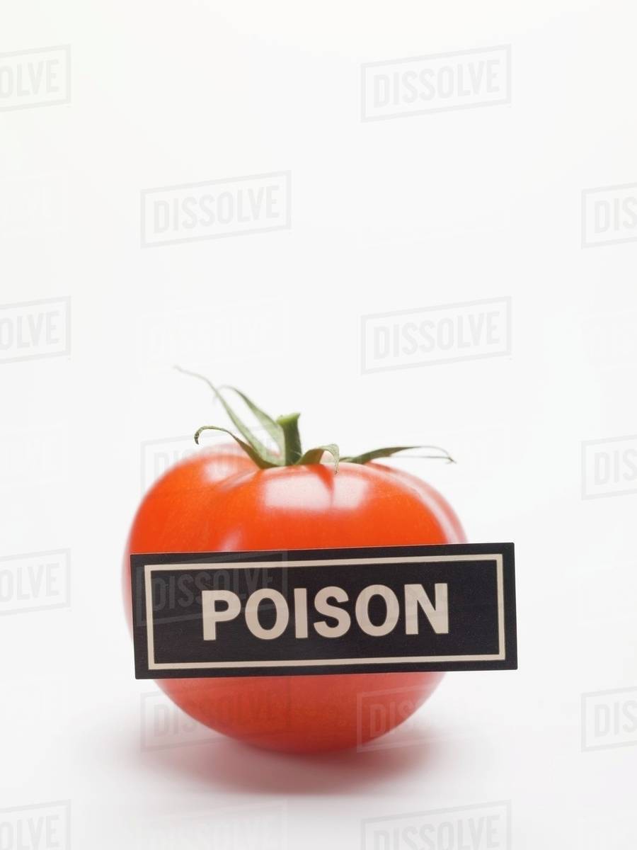 Tomato with a 'POISON' label - Royalty-free Stock Photo | Dissolve