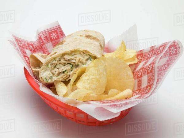 Wrap with crisps in a plastic basket - Royalty-free Stock Photo | Dissolve