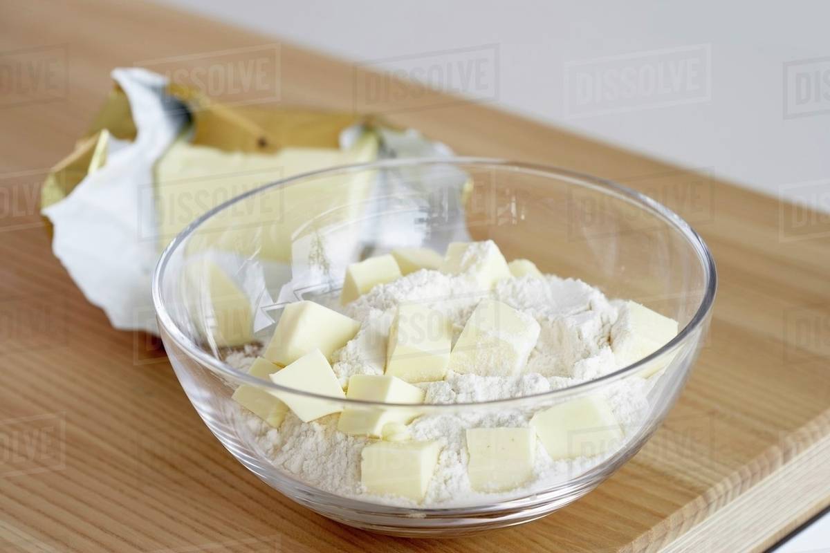 Diced butter and flour in a glass bowl - Royalty-free Stock Photo ...