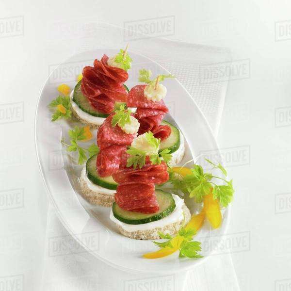 Salami and cucumber canapes - Stock Photo - Dissolve