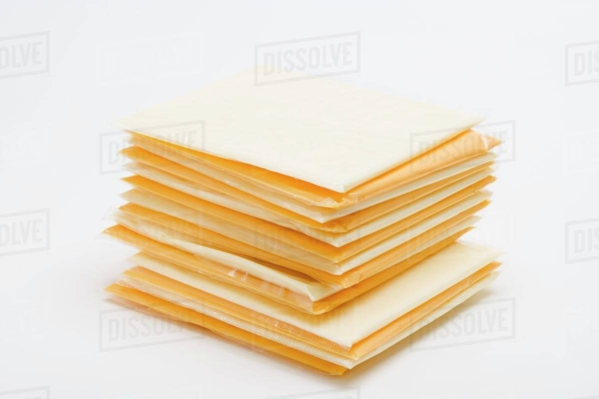 Cheese slices individually wrapped in plastic - Royalty-free Stock ...