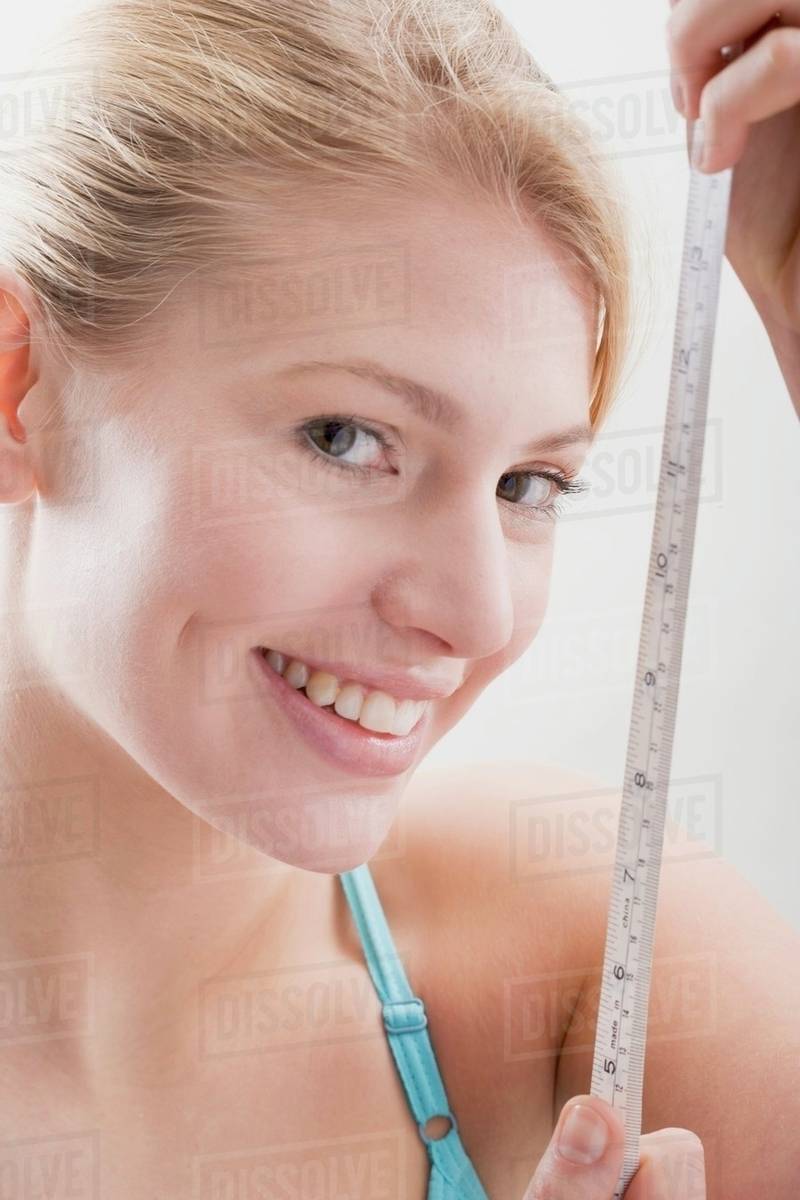 Woman with tape measure - Royalty-free Stock Photo | Dissolve