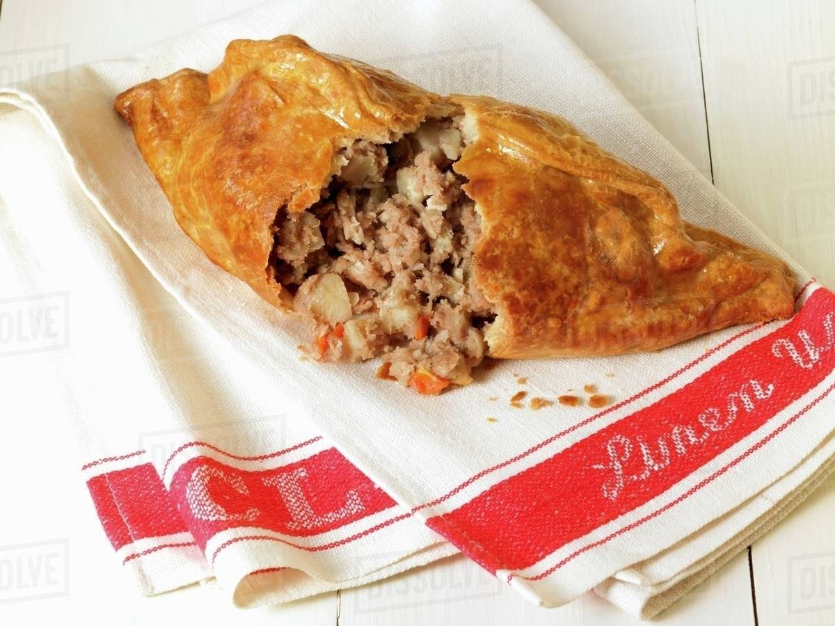 Cornish pasty, broken open on a tea towel - Royalty-free Stock Photo ...