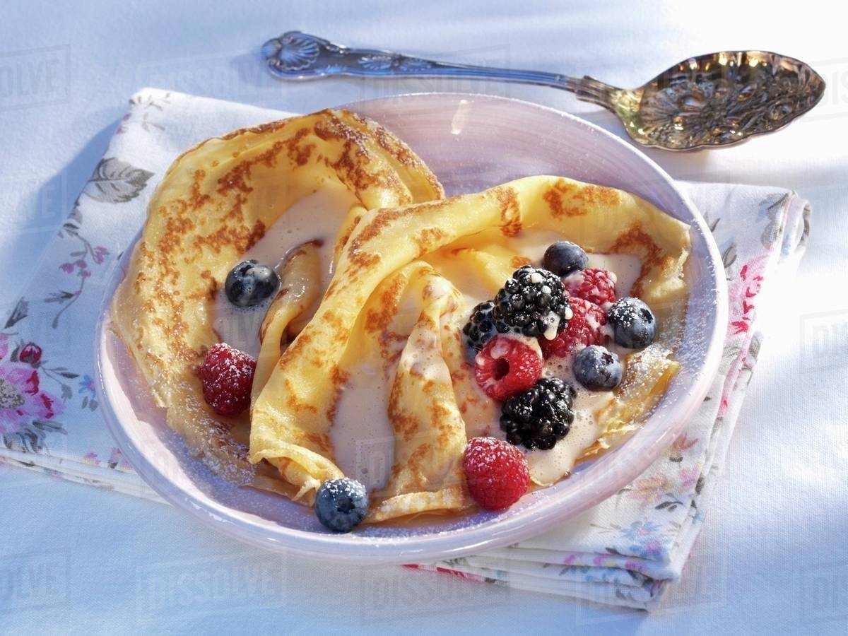 Crepes with berries and vanilla sauce - Royalty-free Stock Photo | Dissolve
